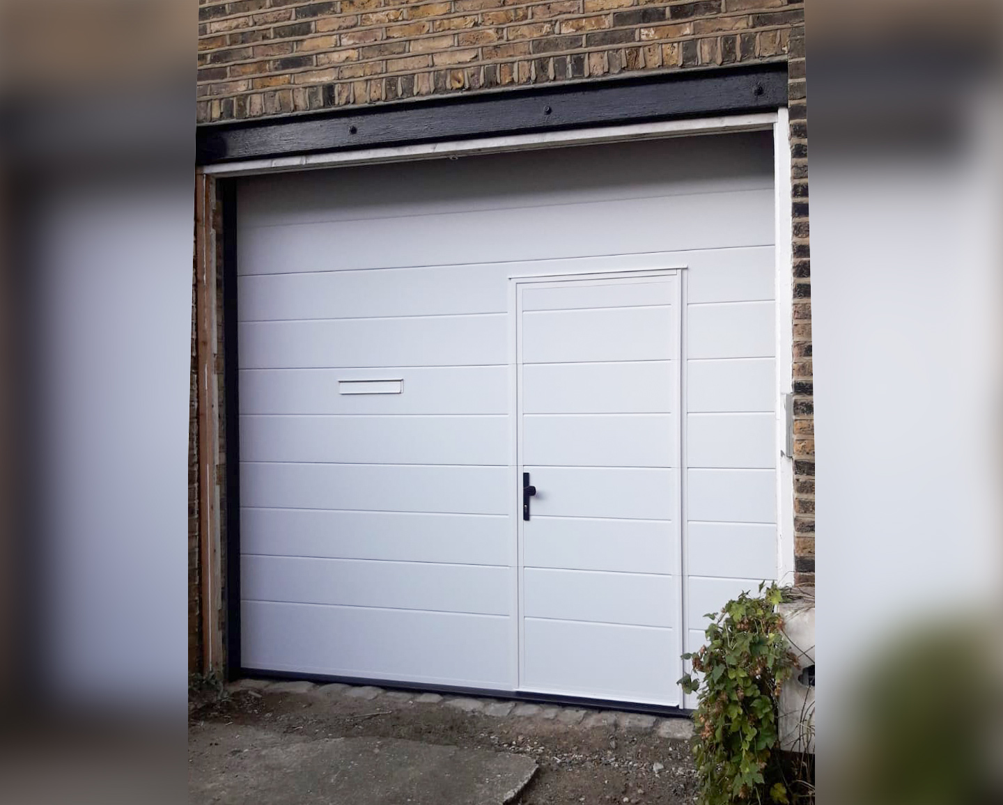 Ryterna Automated Sectional Garage Door with Wicket Door Finished in ...
